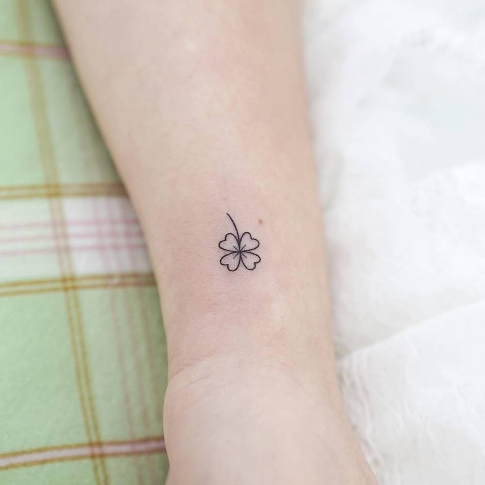 Minimalistic Four Leaf Clover Tattoo Placed On The