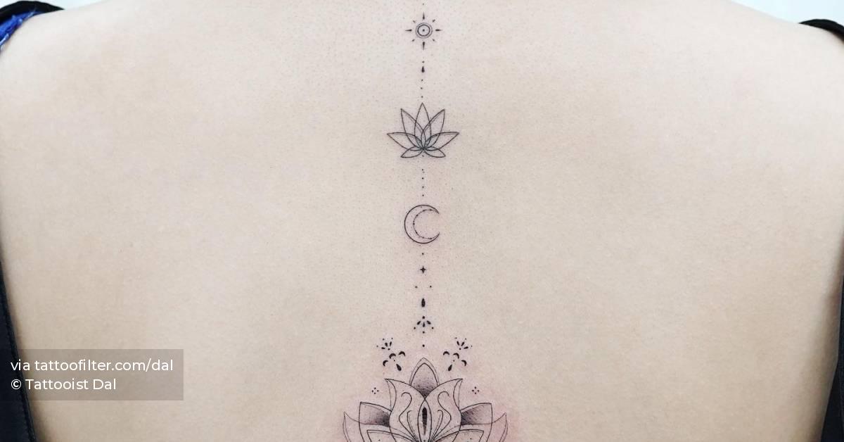 Symbol chain tattooed on the spine.