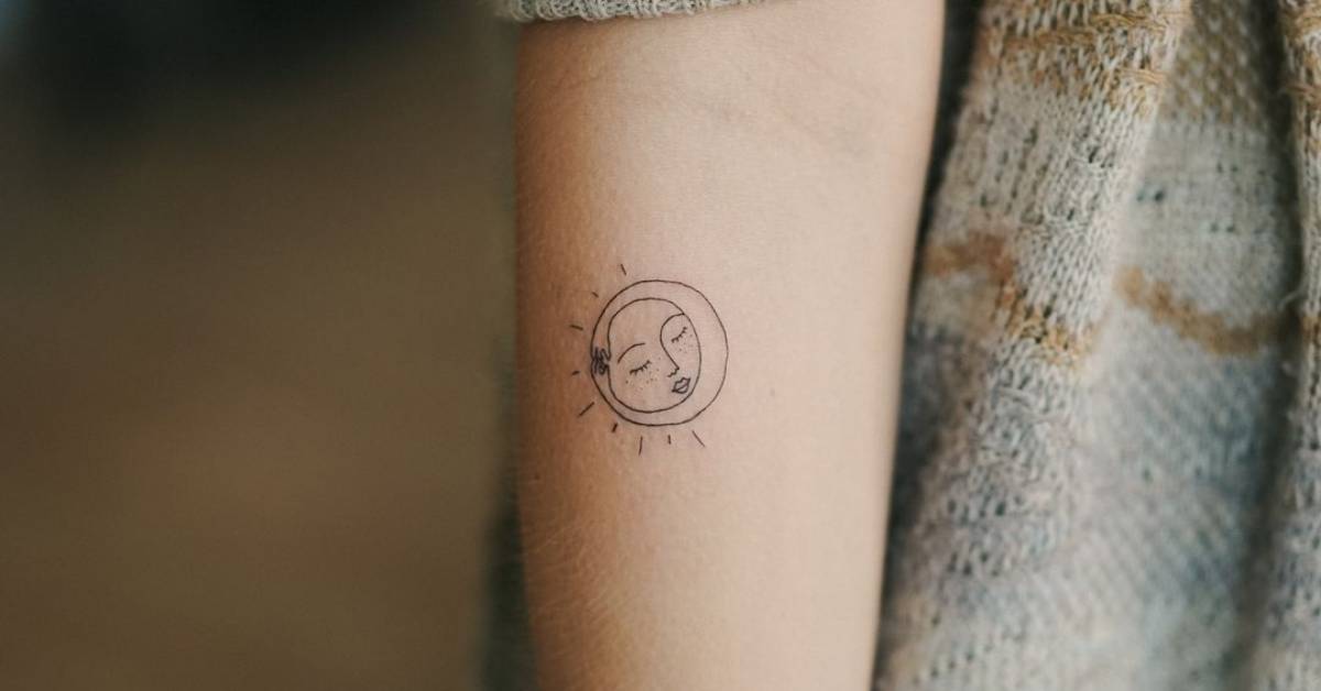 Fine line sun and moon tattoo located on the inner