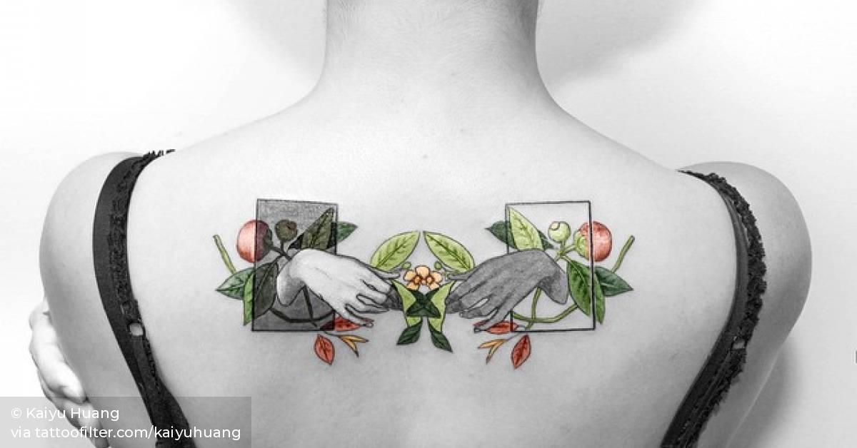 Abstract style tattoo on the upper back.