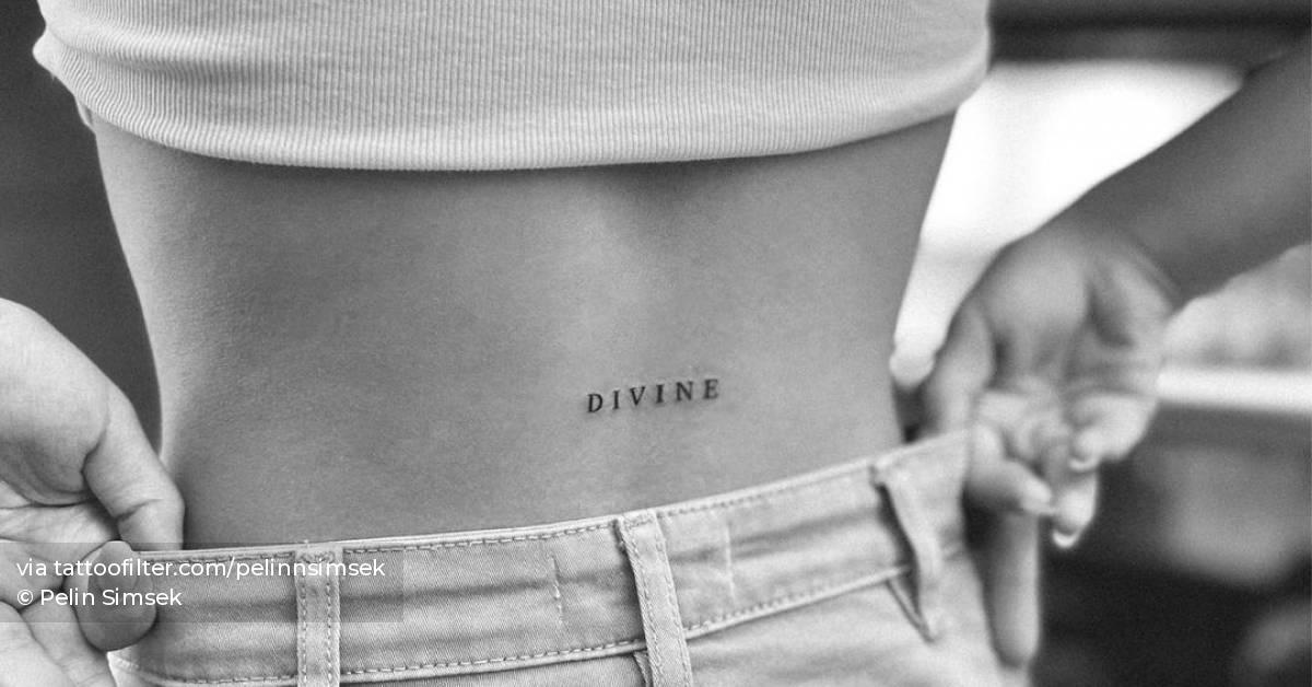Tattoo of the word "divine" located on the lower back.
