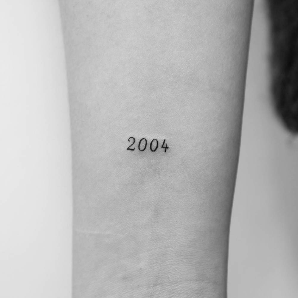 2004 Lettering Tattoo Located On The Wrist 2004 Lettering Tattoo Located On The Wrist
