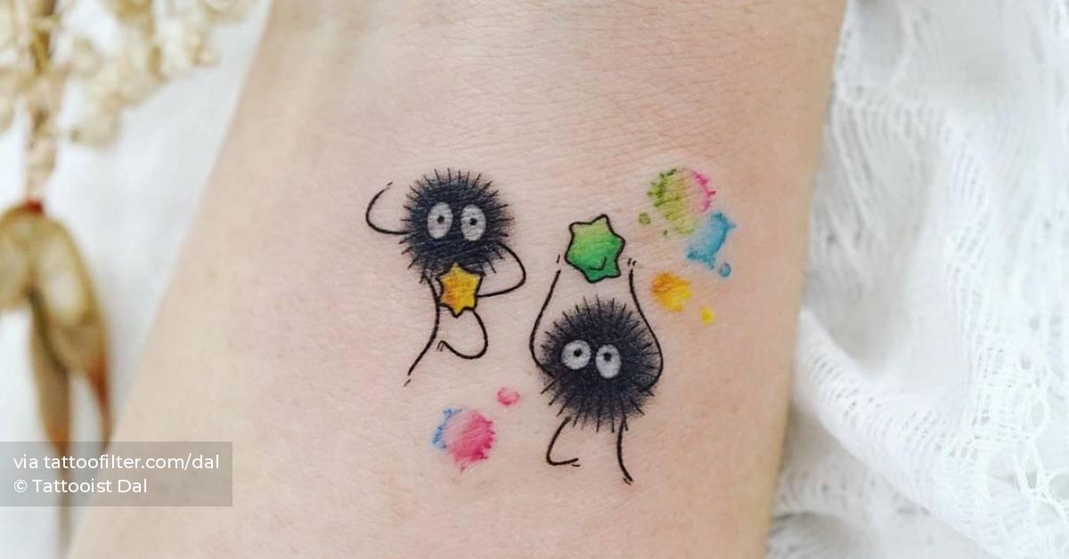 Soot Sprites tattoo located on the wrist, cartoon