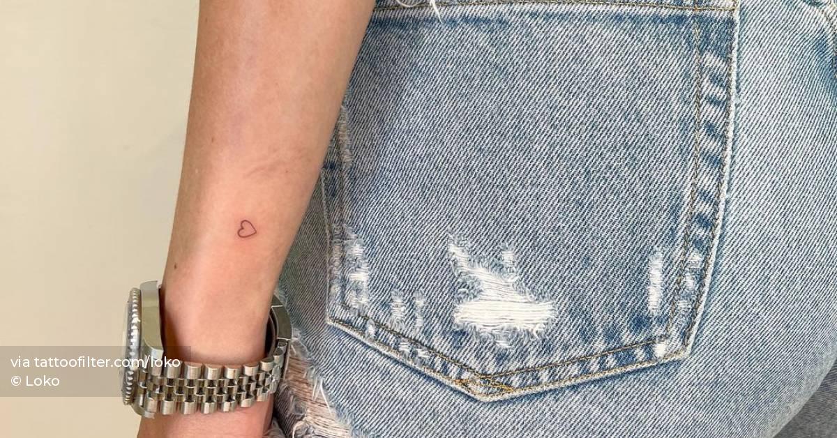 Micro heart tattoo done on the wrist, minimalistic