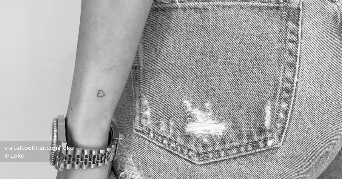 Micro heart tattoo done on the wrist, minimalistic