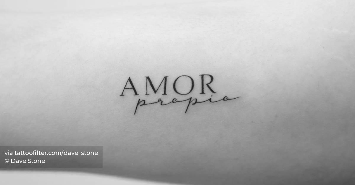 "Amor propio" lettering tattoo placed on the inner arm.