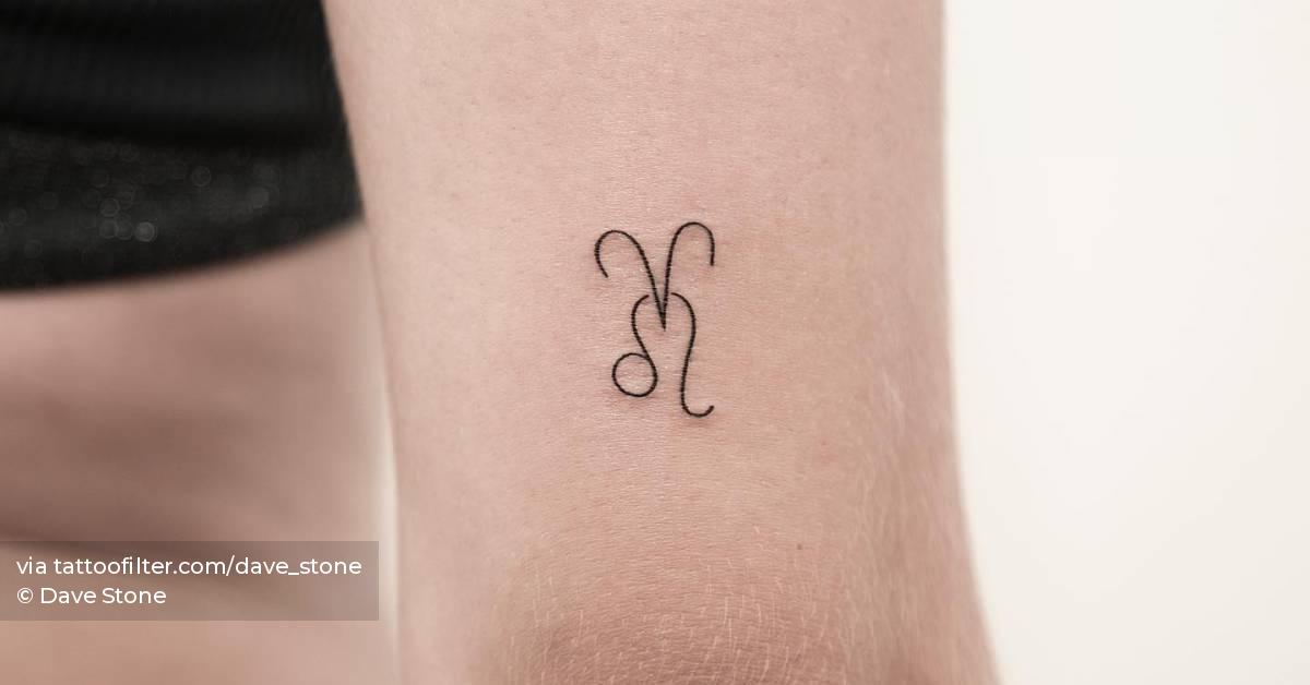 Aries and Leo zodiac symbols tattooed on the tricep.