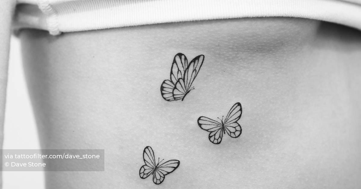 FIne line butterflies tattoo located on the rib.