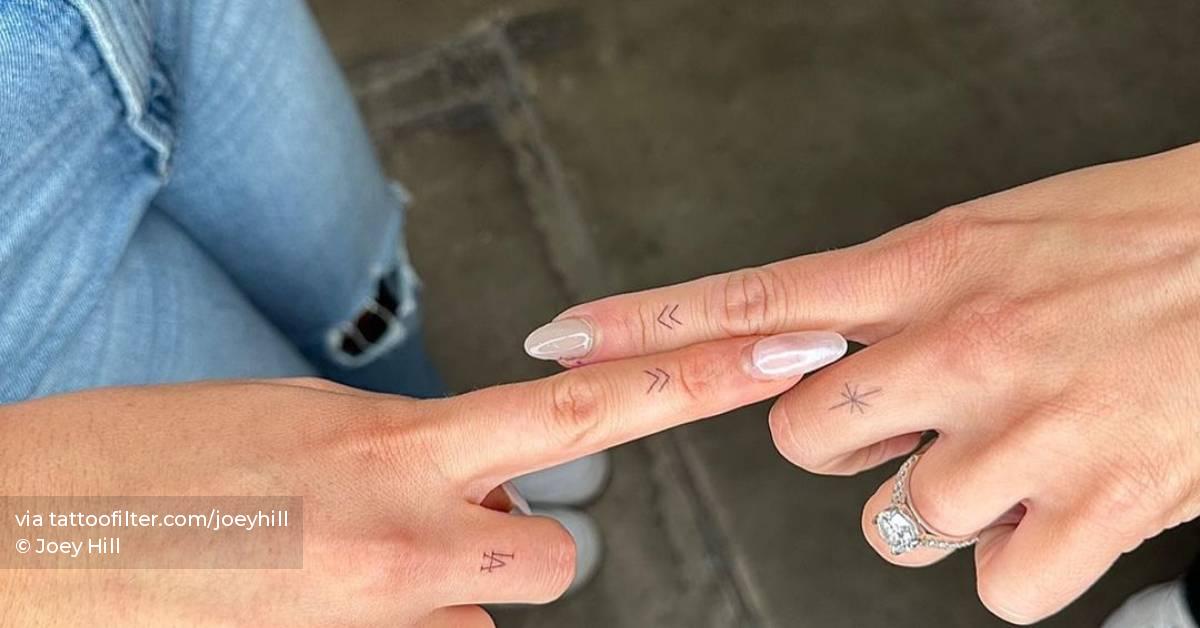 Minimalistic matching finger tats for best friends.
