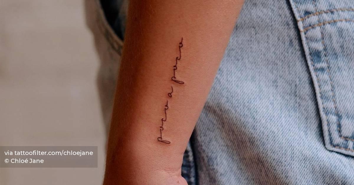 "Poco a poco" lettering tattoo handwritten on the