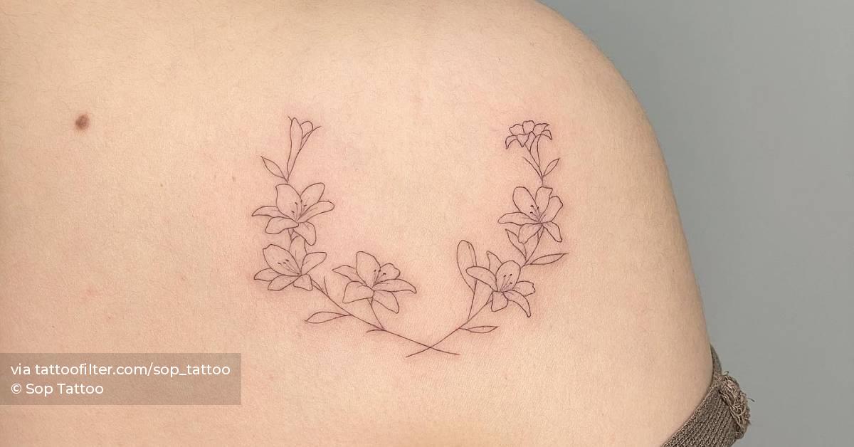 Fine line laurel wreath tattoo located on the shoulder