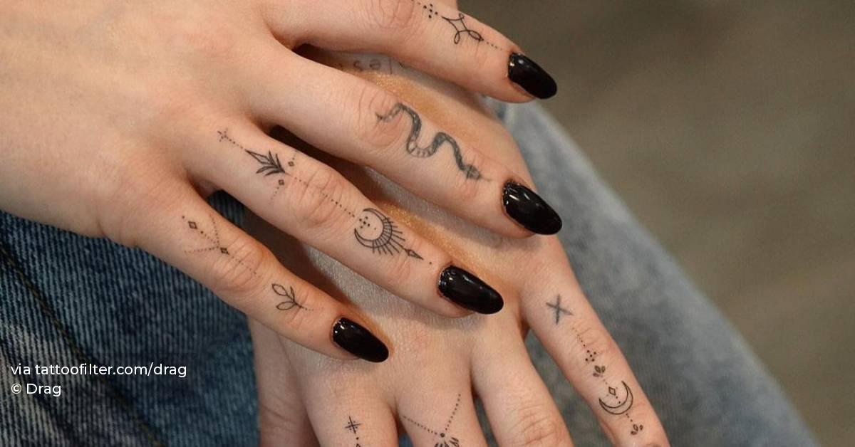 Finger tats on Dove Cameron's hands.