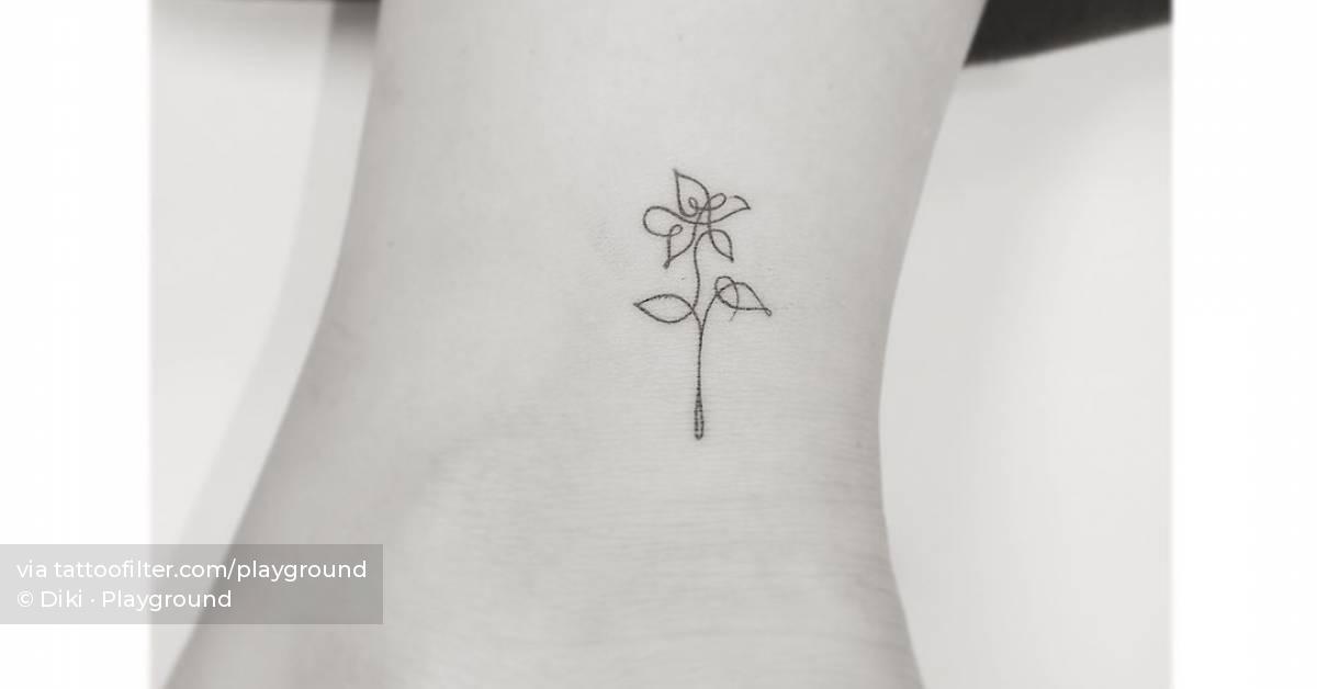 One line flower tattoo done on the ankle, minimalistic