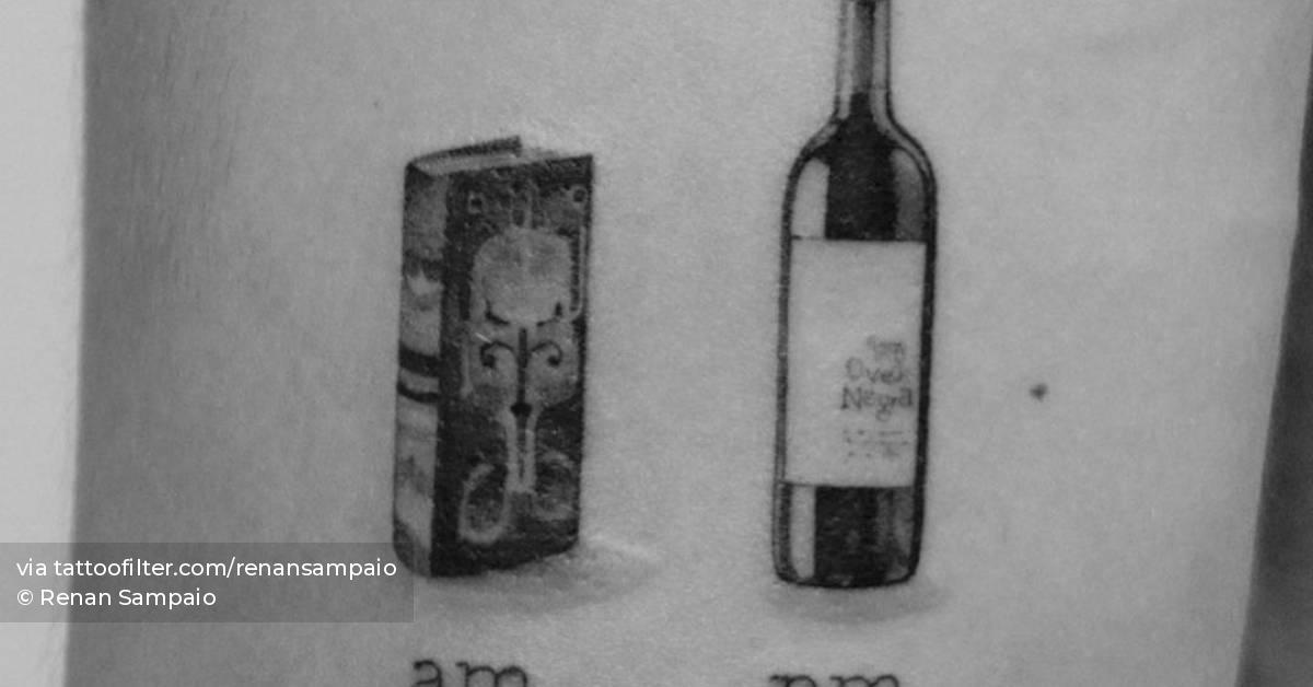 A.M. and P.M. - Book and wine bottle tattoo located on