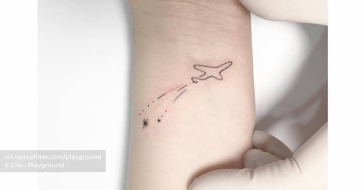 Fine line airplane tattoo done on the wrist.