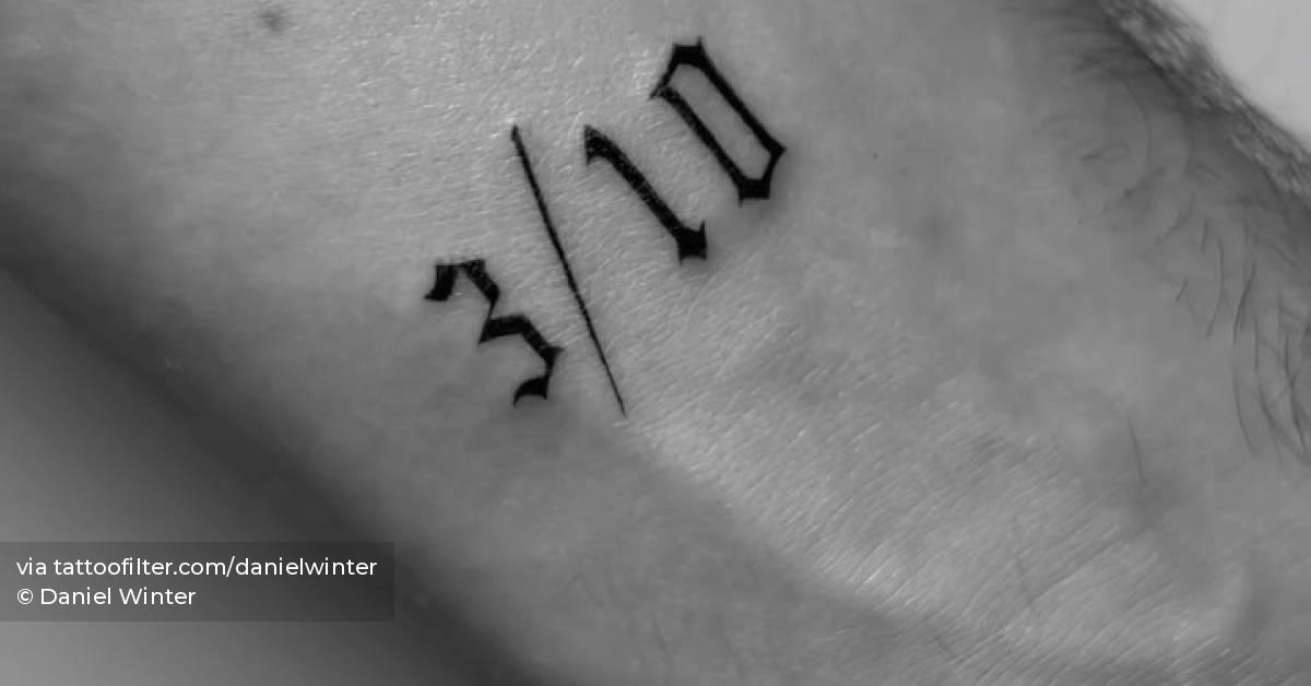 3/10 lettering tattoo located on the wrist.