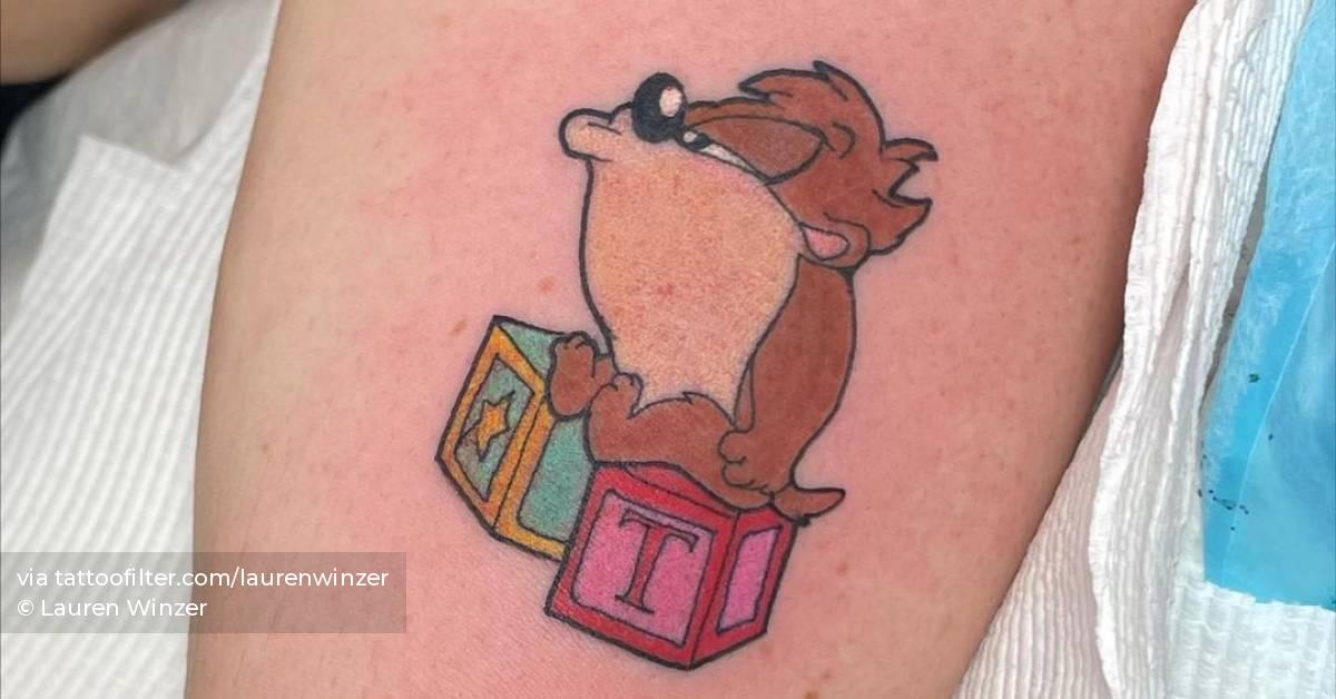 Cheeky baby Tazzie tattooed on the upper arm.