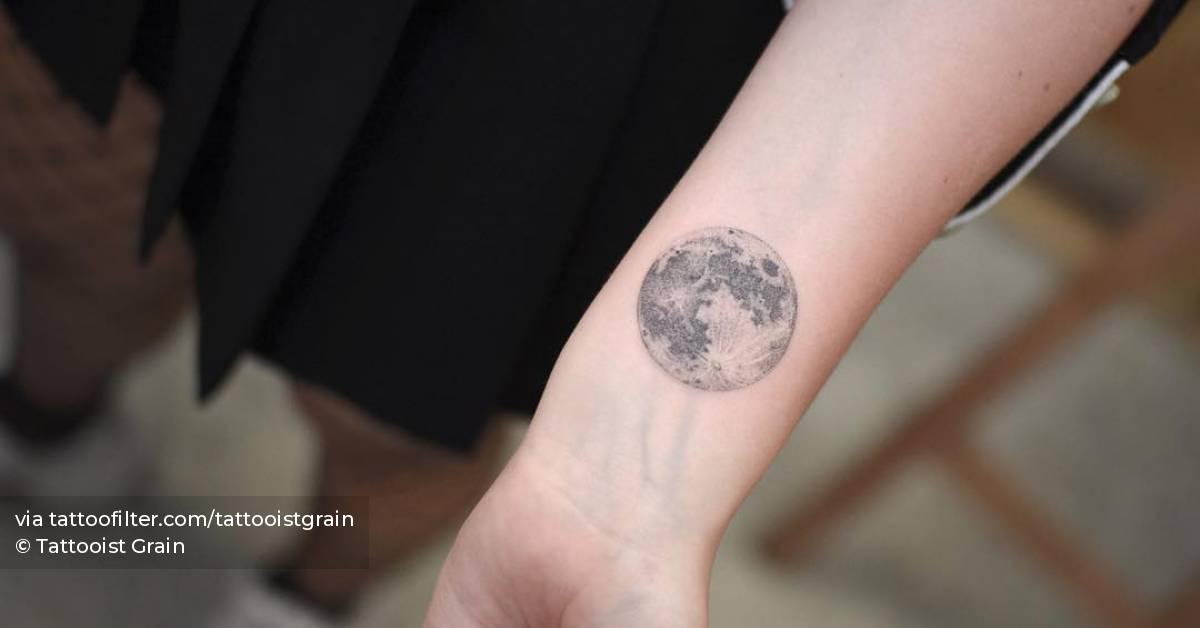 Micro-realistic style full moon tattoo placed on the