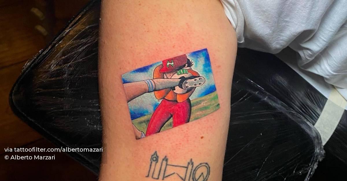 Captain Tsubasa tattoo located on the tricep, cartoon