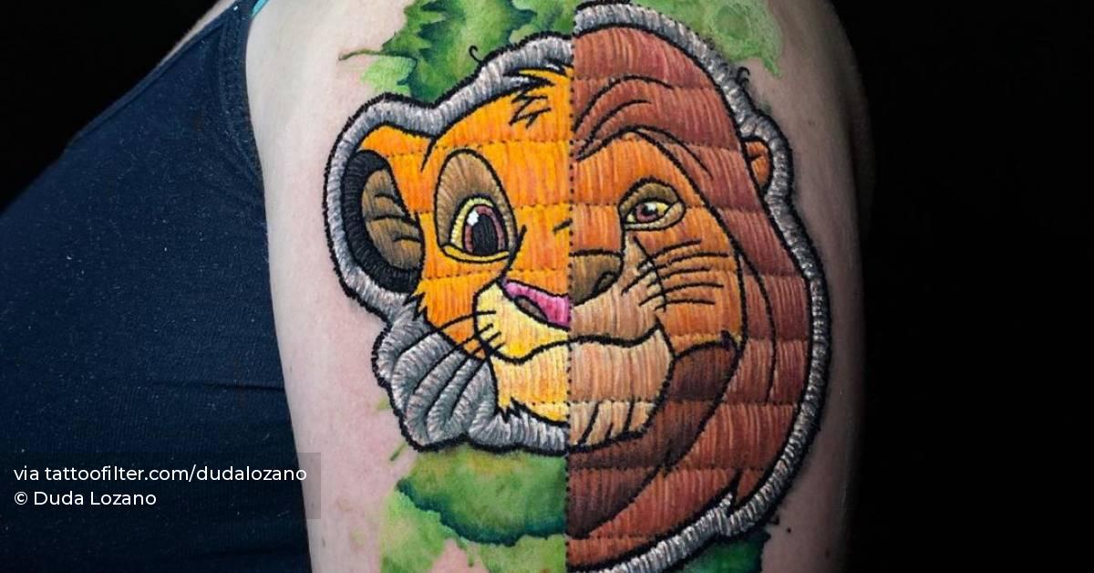 Simba patch tattooed on the upper arm, embroidery