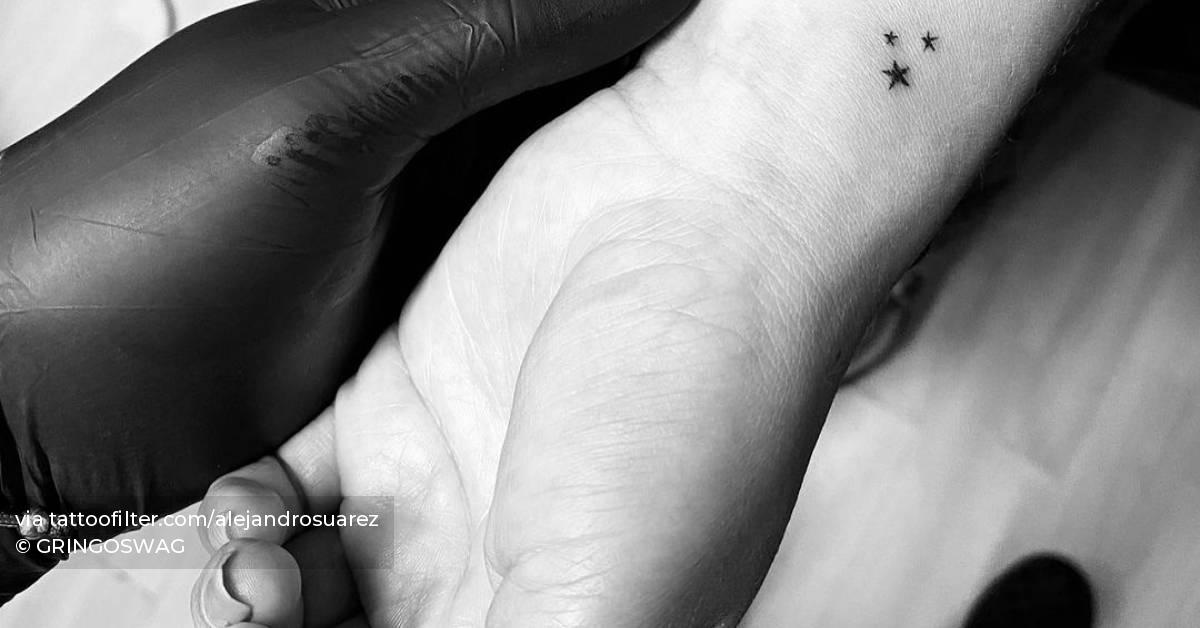 Harry Potter book stars tattooed on the wrist,