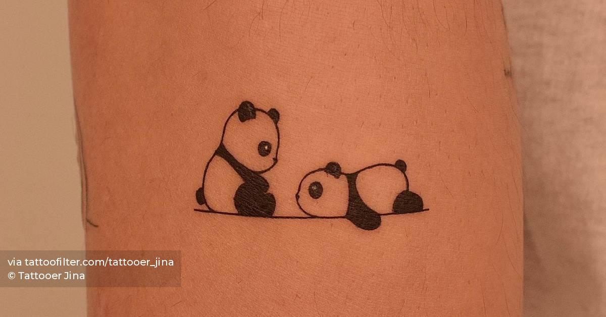 Little pandas tattooed on the forearm, minimalistic