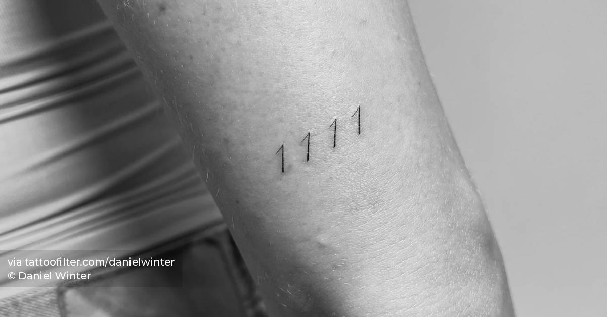 Angel number "1111" tattooed on the tricep.