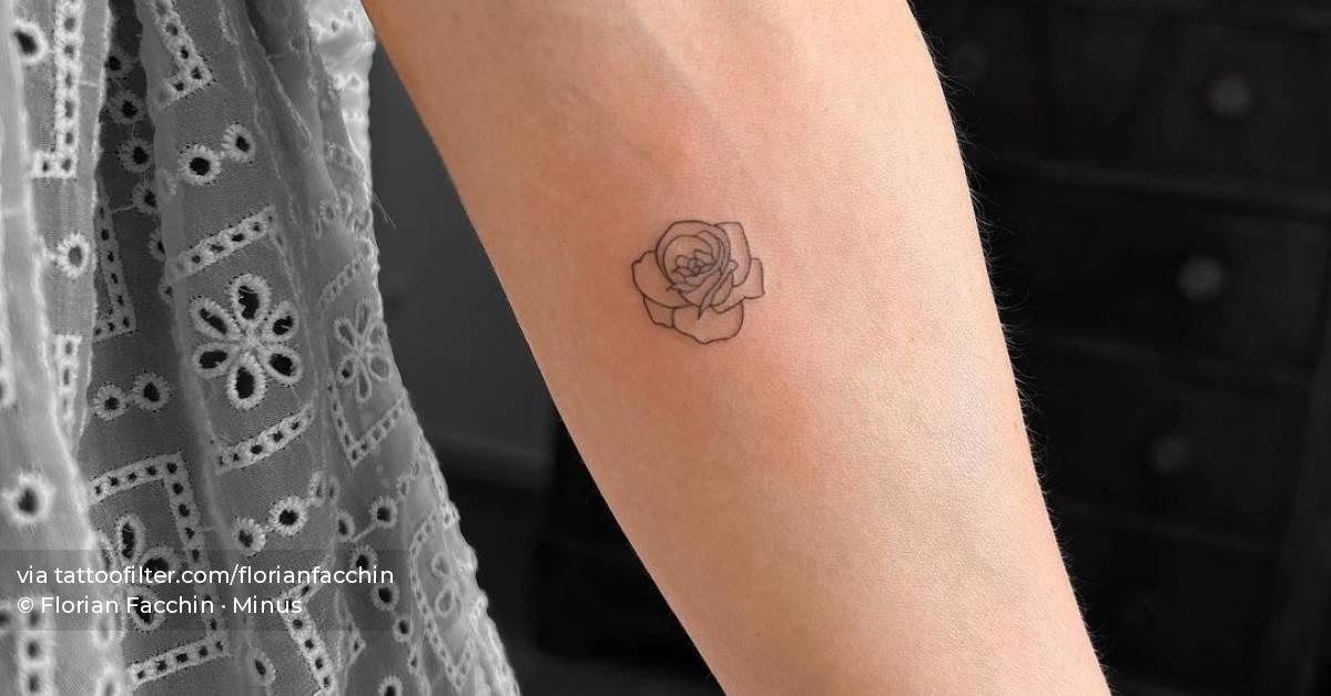 Fine line rose head tattoo done on the inner forearm,