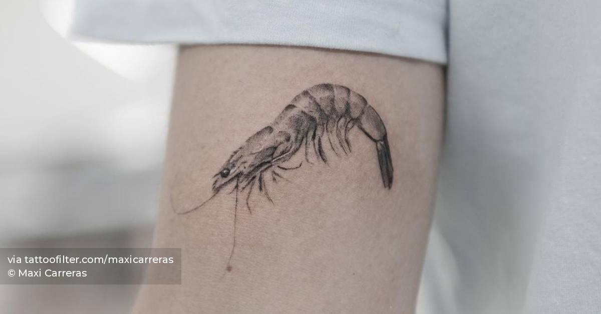 Micro-realistic shrimp tattoo placed on the inner arm.