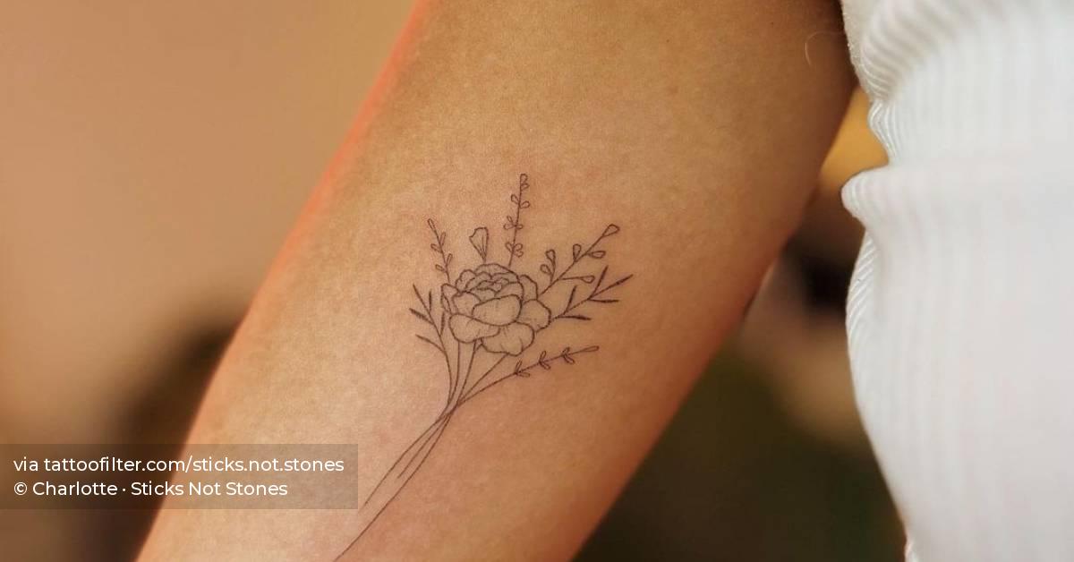 Flower bouquet tattoo located on the inner arm, fine