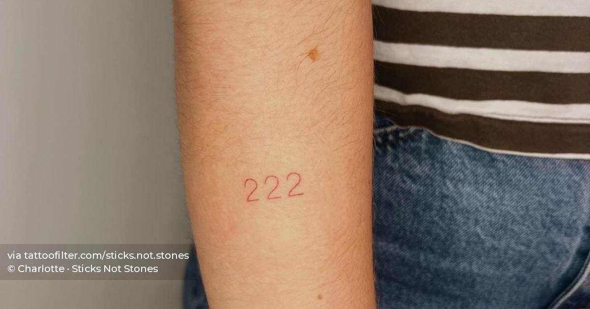 Tattoo of the number "222" in red ink located on the