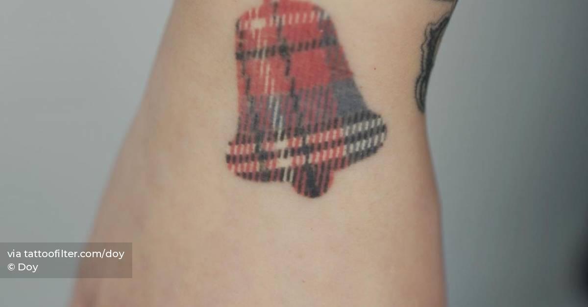 5 years healed, handpoked tartan bell tattoo located on