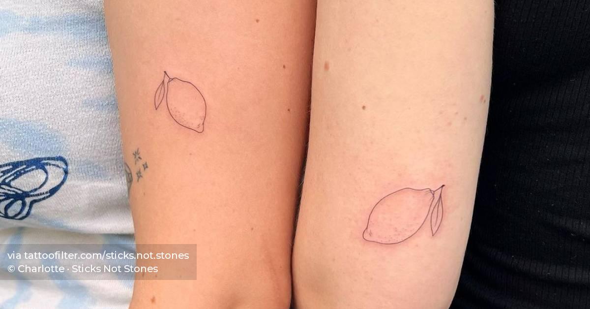 Matching hand poked lemon tattoo for best friends.