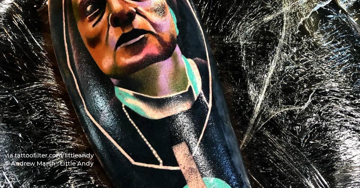 Nun portrait tattoo located on the shin.