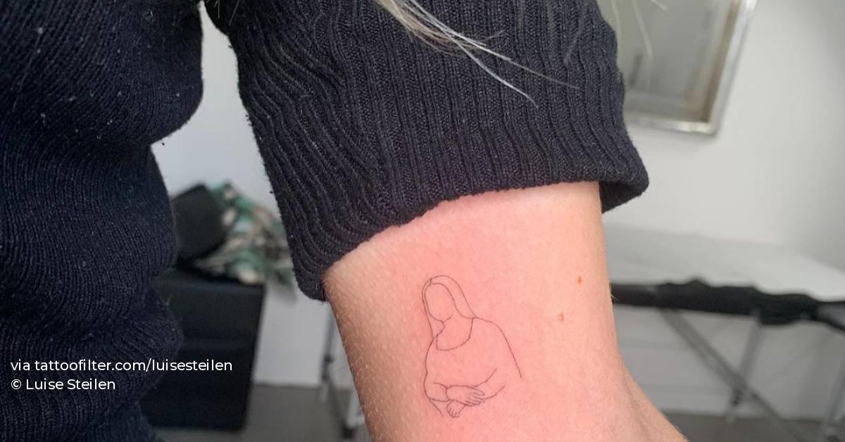 Minimalist Mona Lisa tattoo on the inner arm.