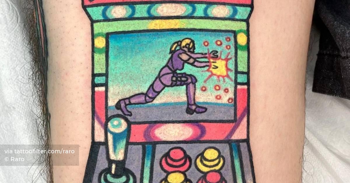 Tekken arcade cabinet tattoo located on the inner arm.