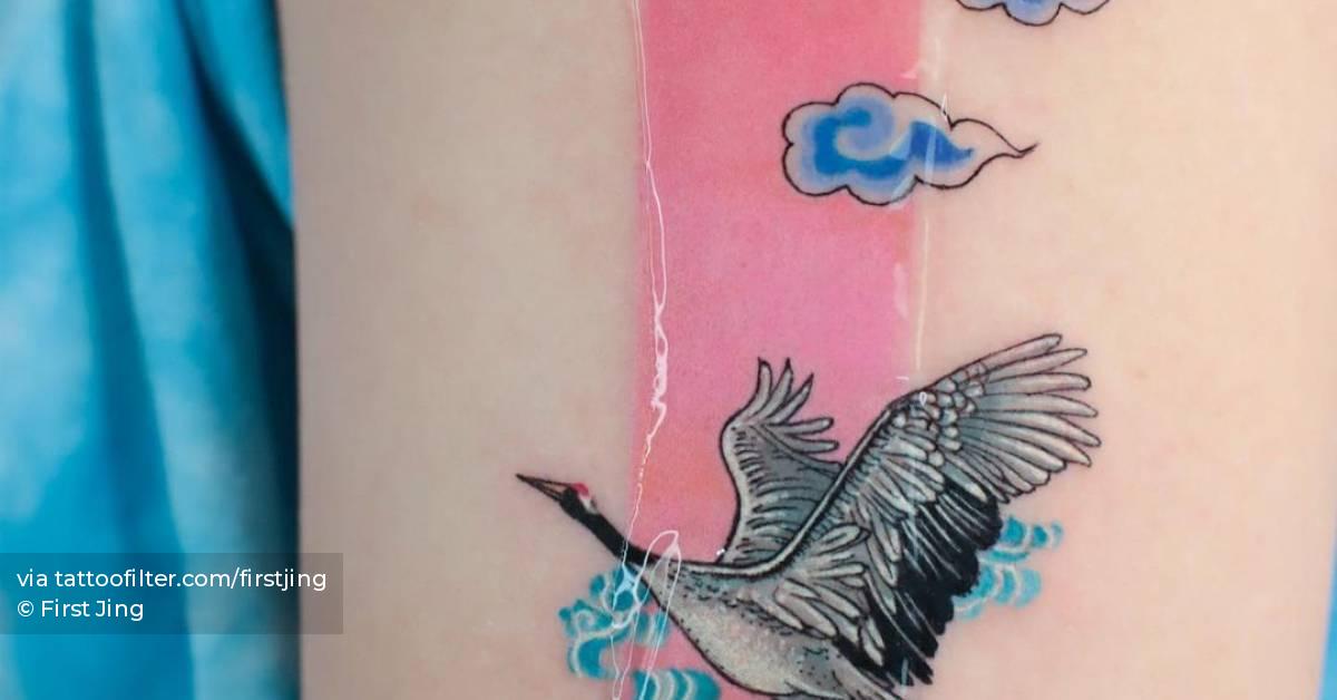 Red-crowned crane tattoo on the upper arm