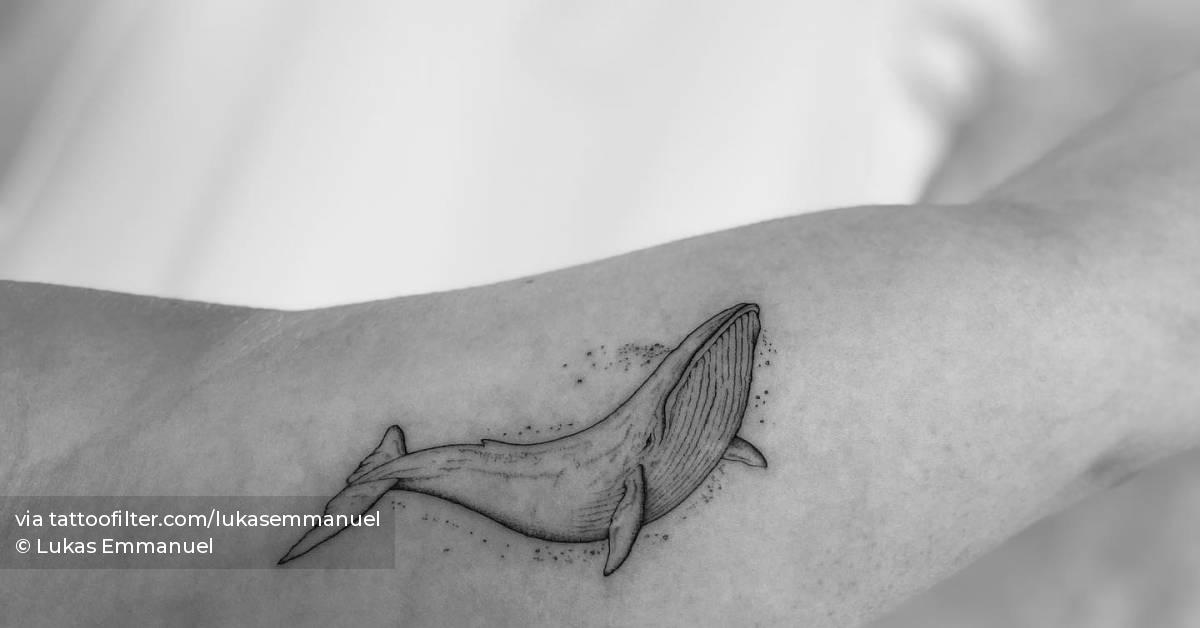 Whale tattoo done in fine line, located on the inner
