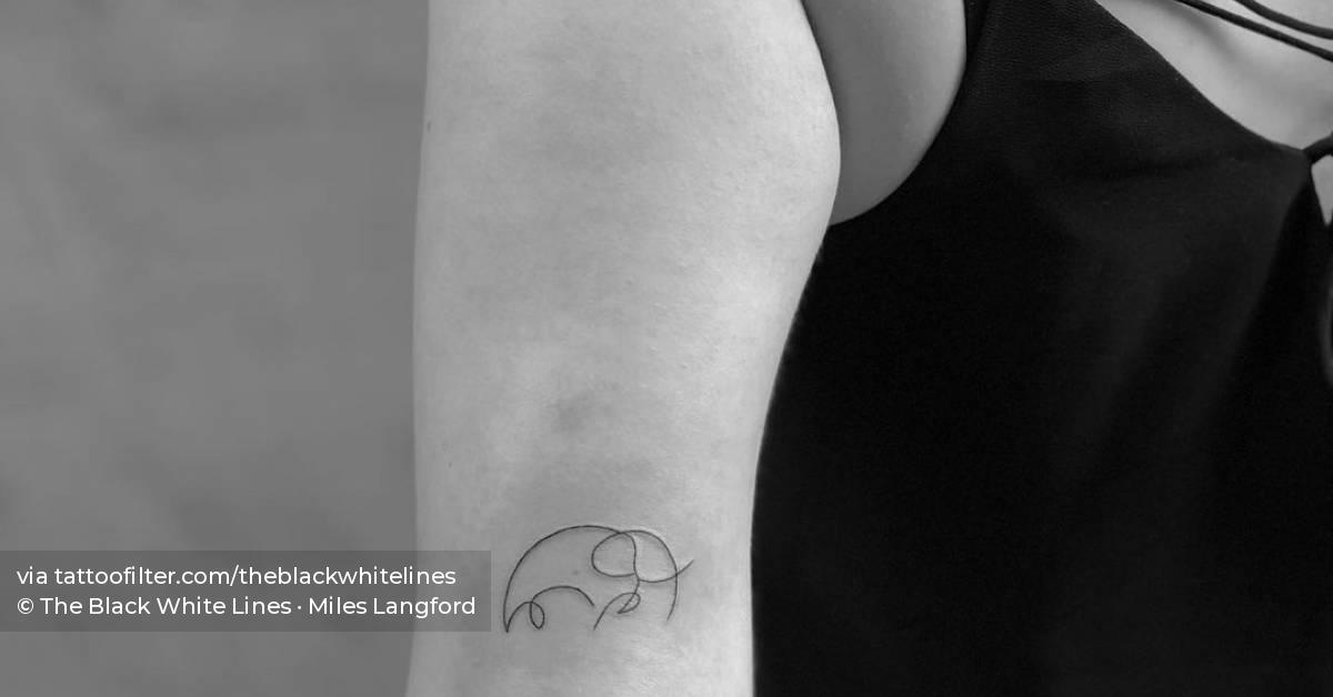 Fine line elephant tattoo on the tricep.