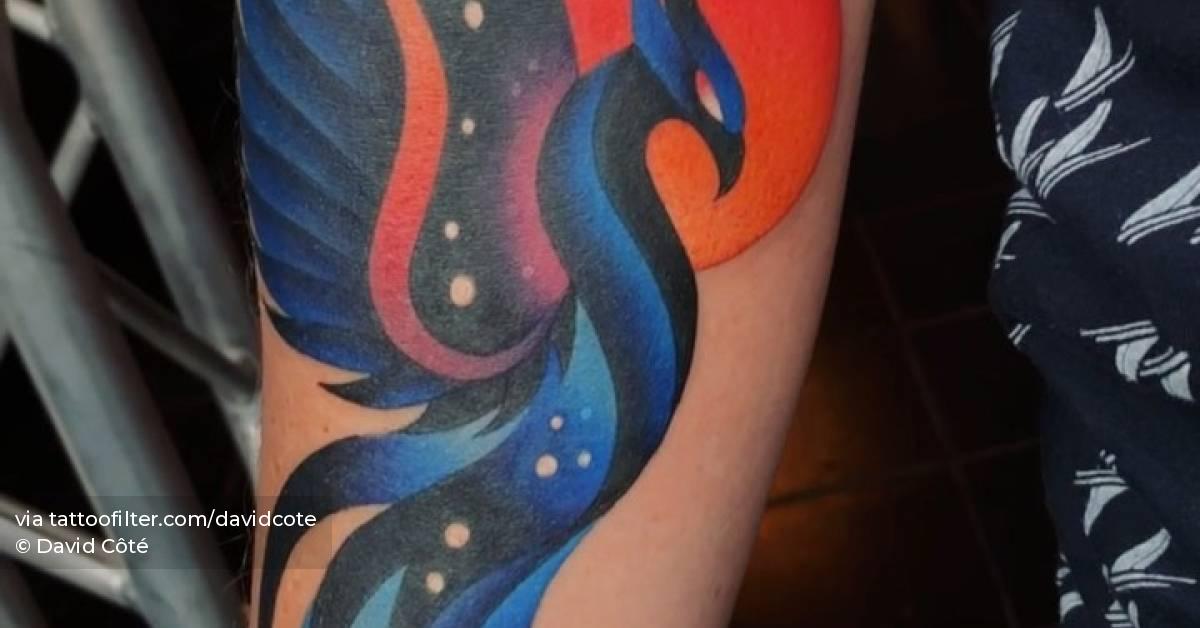 Phoenix tattoo on the inner forearm.