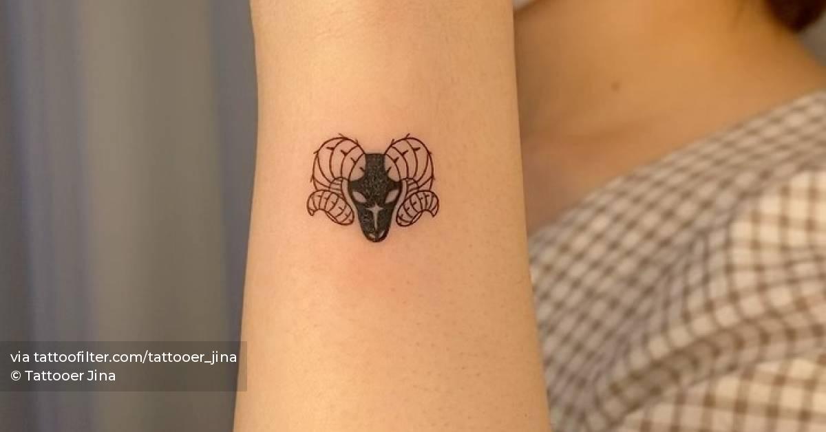 Minimalist ram skull tattoo on the wrist.