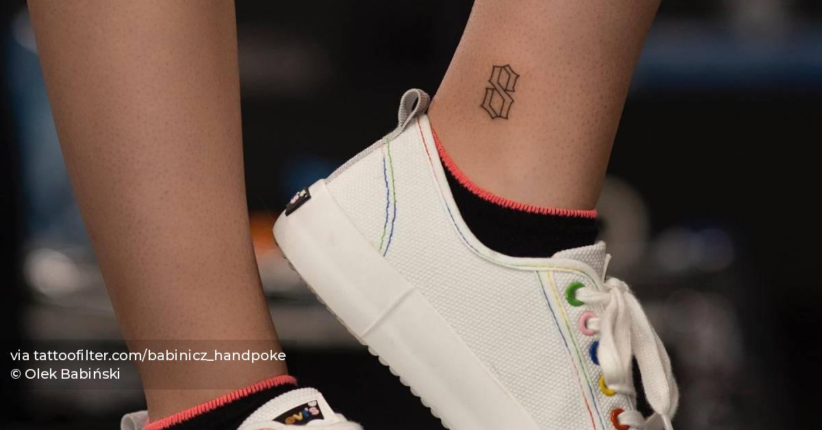 Number "8" tattoo done on the ankle, hand poked style.