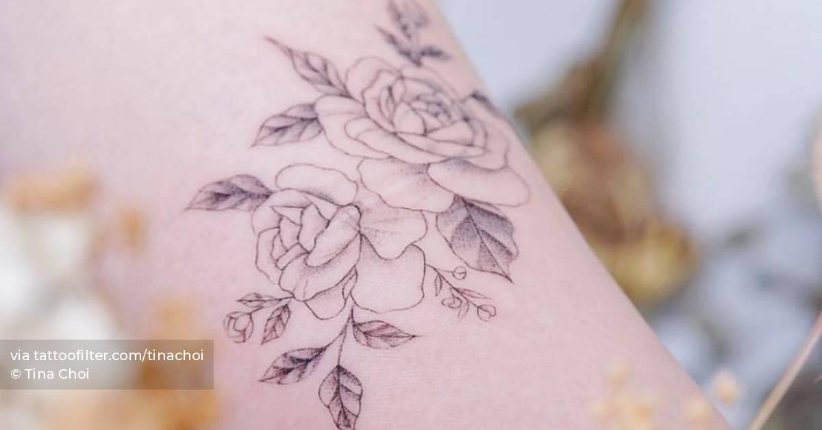 Fine line roses tattoo on the inner forearm.