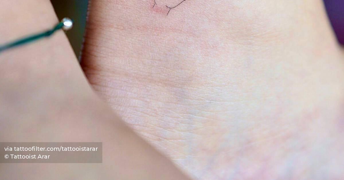 ILY sign on the ankle.