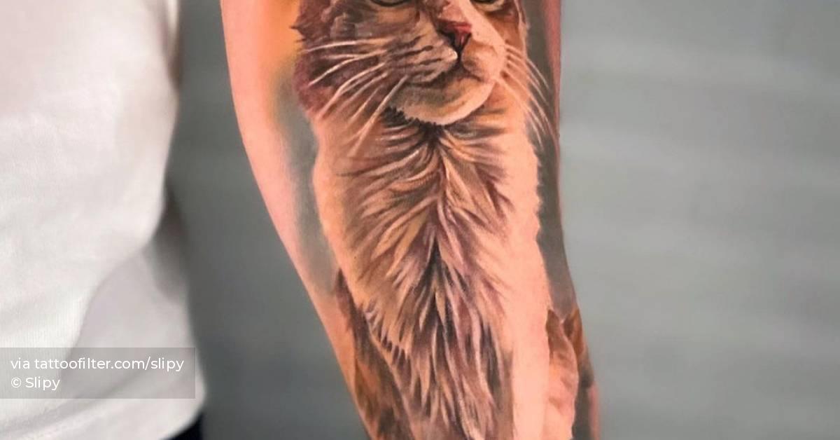 1 month healed cat tattoo located on the inner forearm.