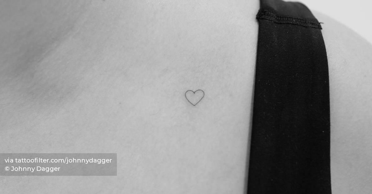 Mini heart tattoo located on the collarbone,