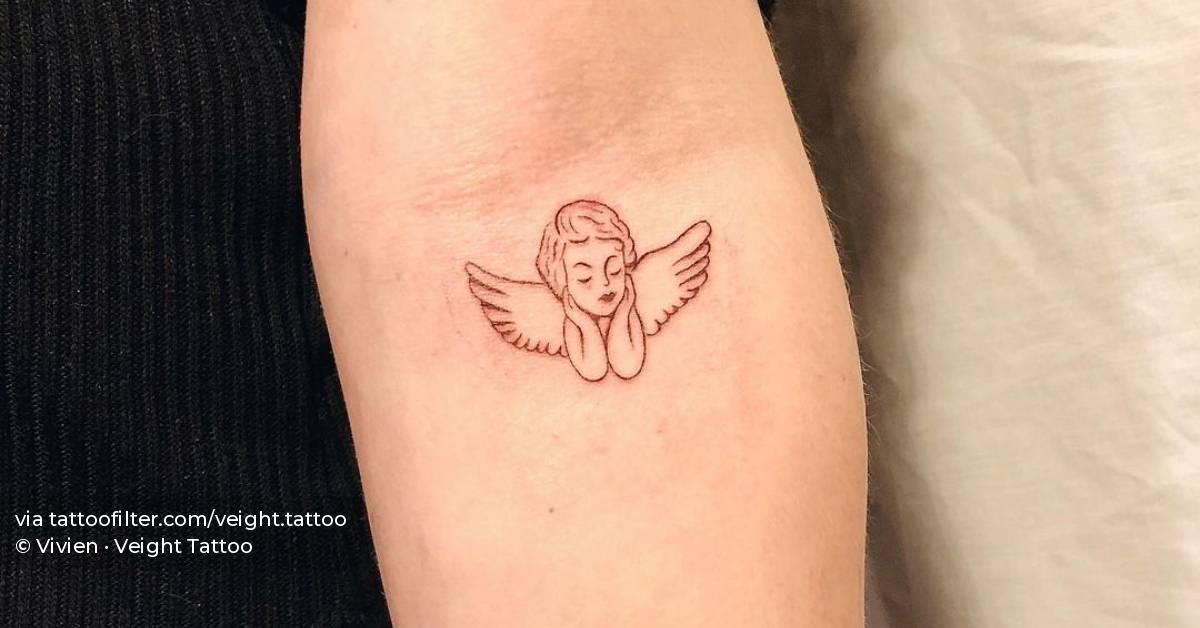 Small cherub tattoo done in fine line, located on the