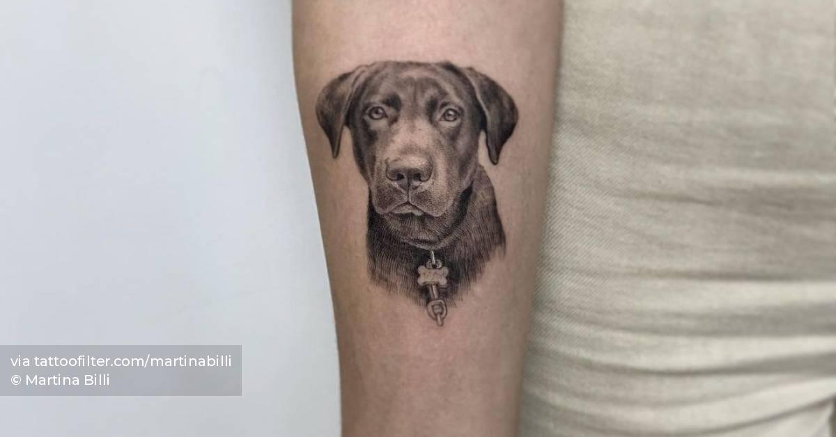 Micro-realistic labrador portrait tattoo on the inner