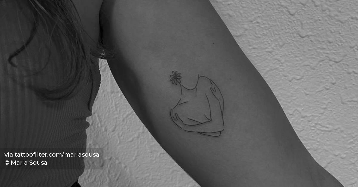 Fine line self love tattoo on the inner arm.