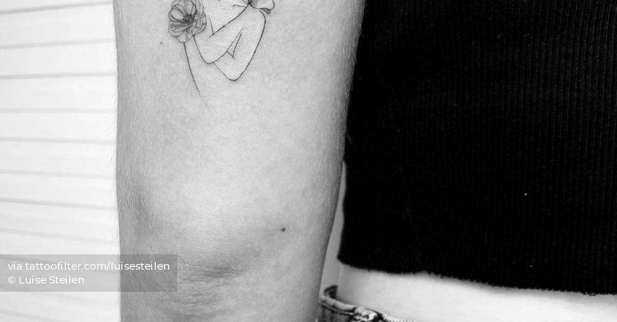 Fine line self love tattoo on the tricep.